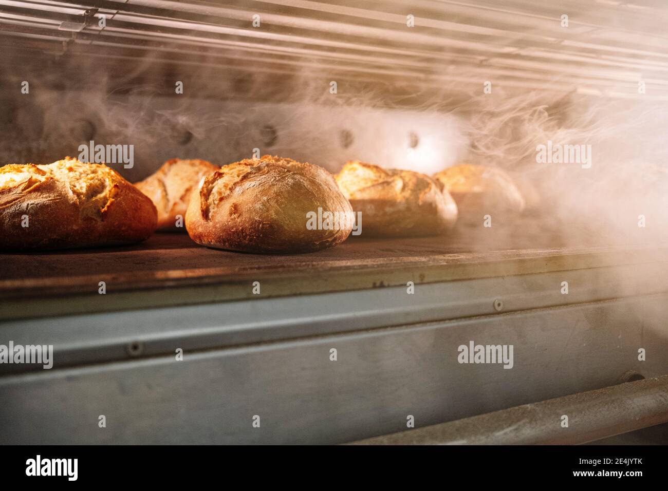 Breads in oven at bakery Stock Photo - Alamy