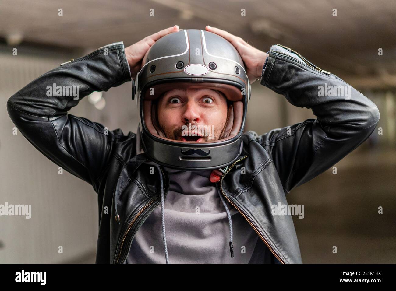 Wearing helmet in car hi-res stock photography and images - Alamy