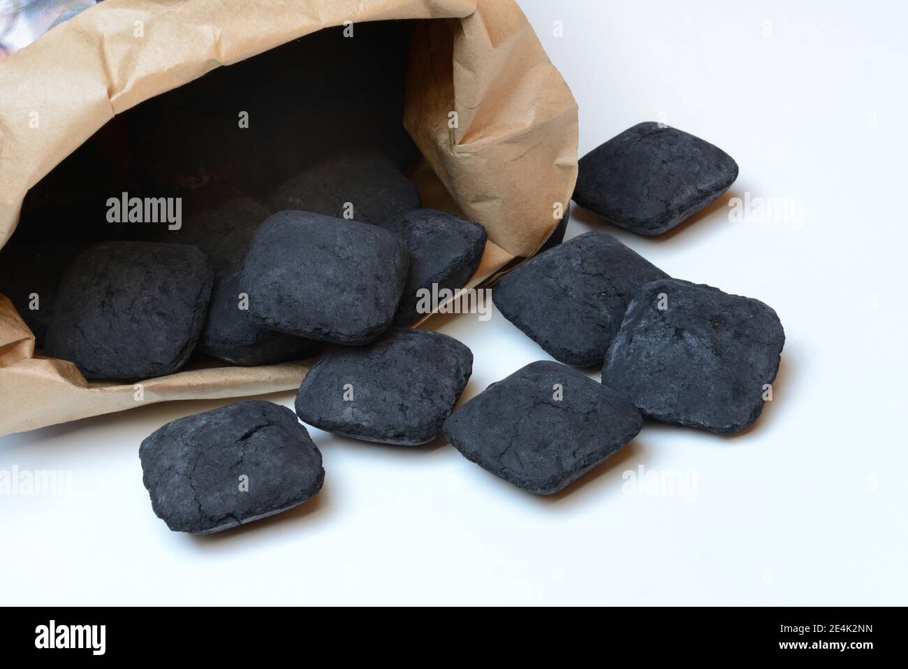 Charcoal briquettes, paper bag Stock Photo - Alamy