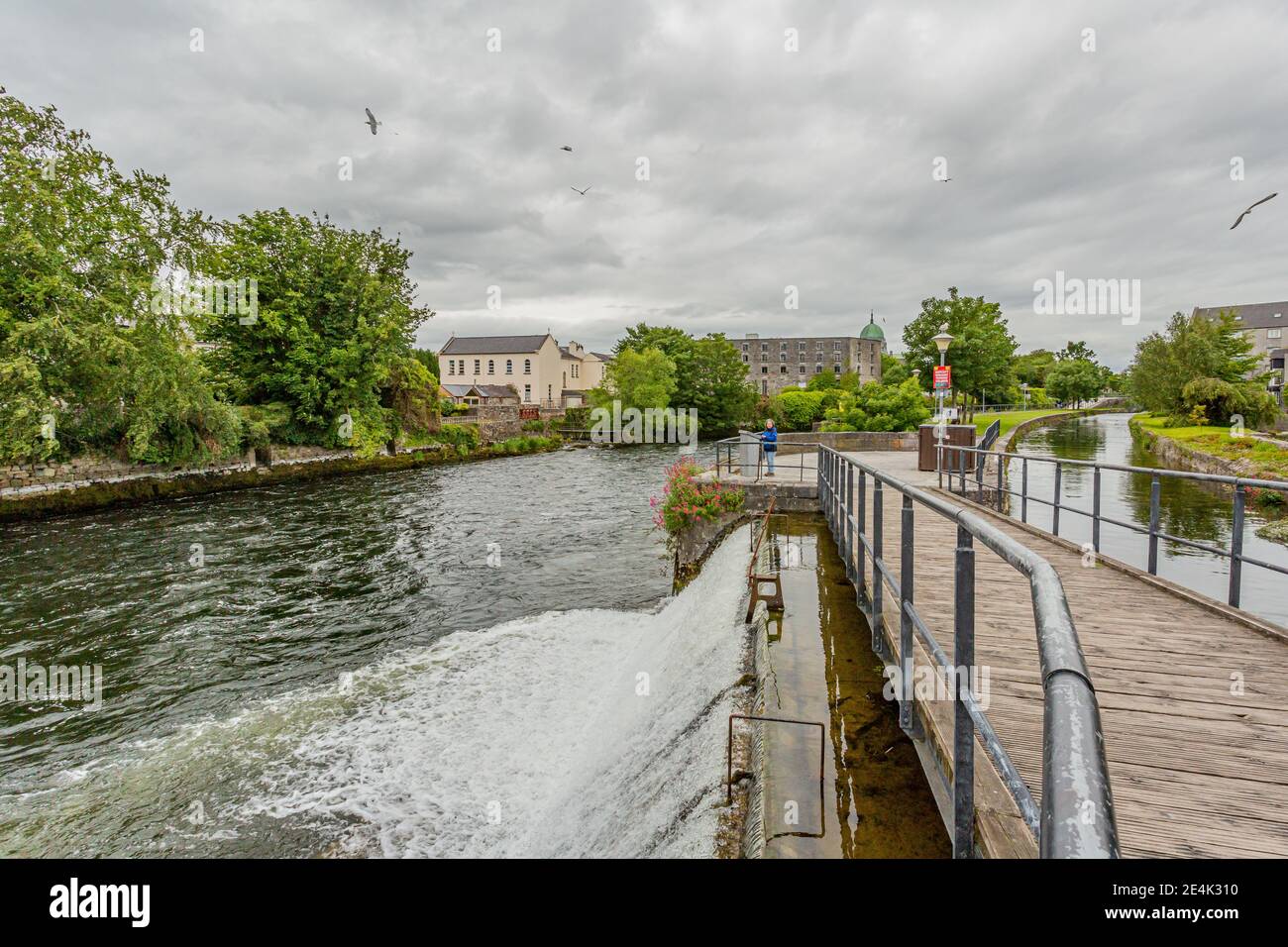 Pedestrian walkway between the River Corrib and a side canal parallel ...