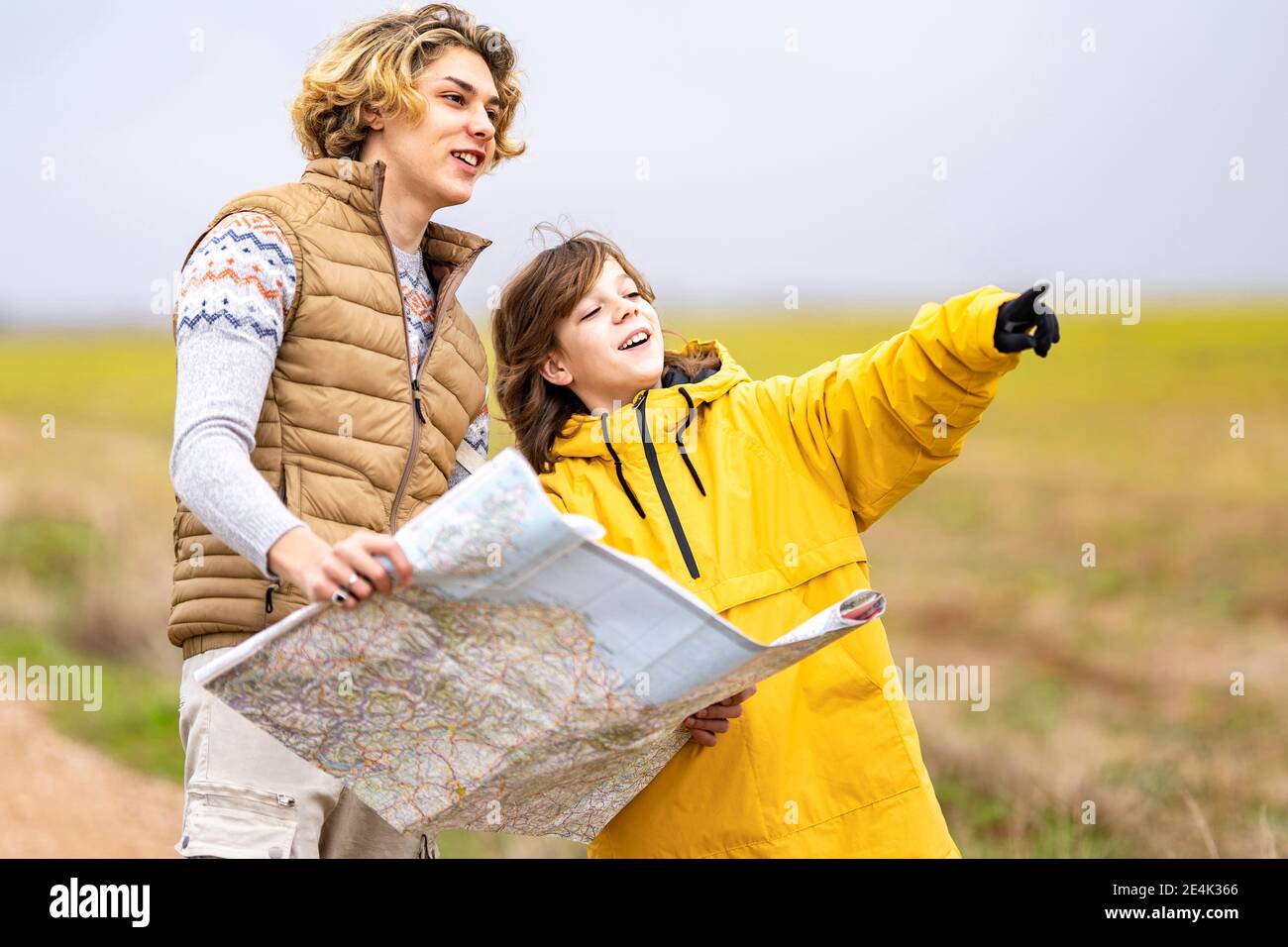 Two brothers checking map during hike Stock Photo - Alamy