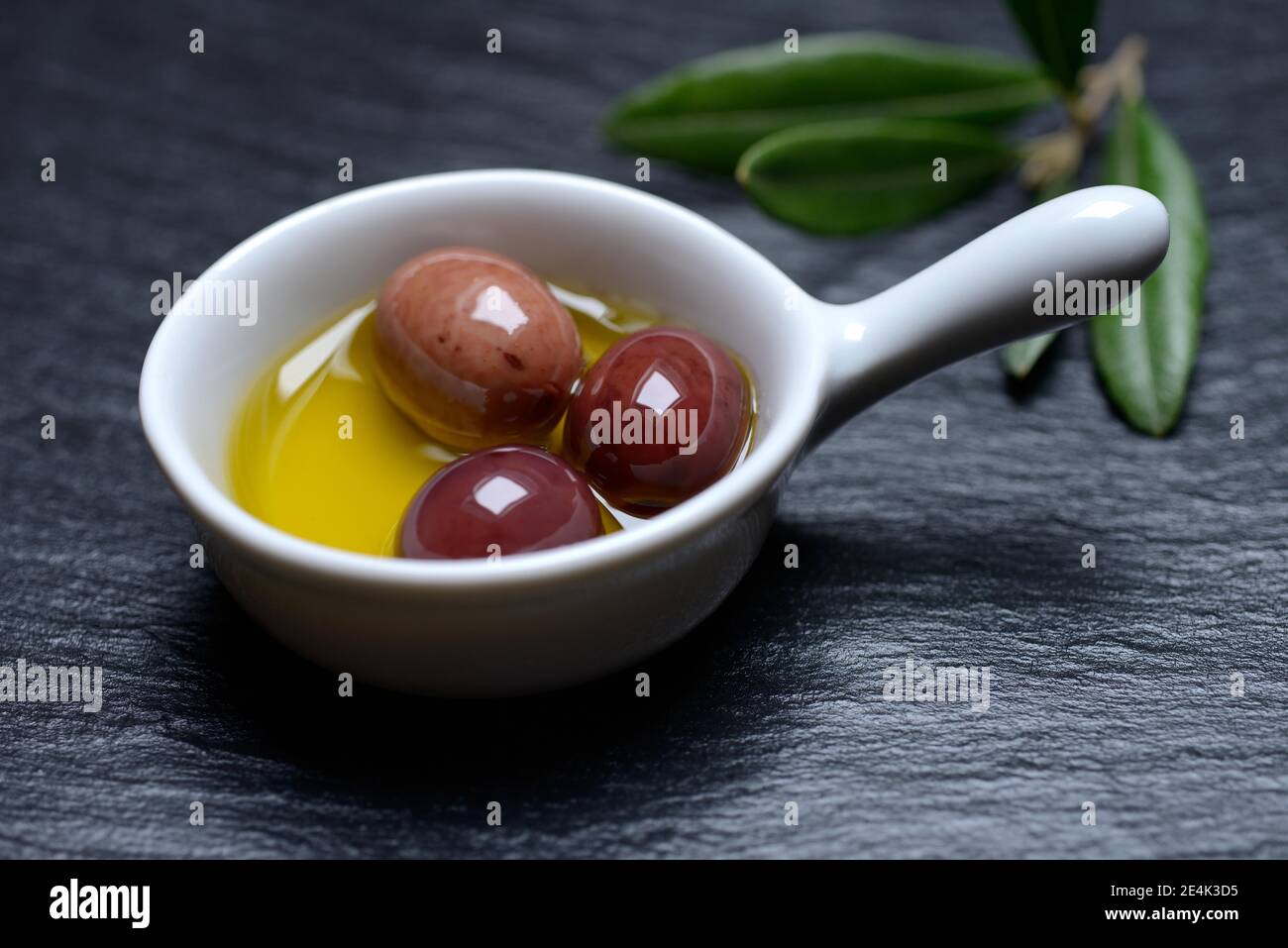Olive oil and olives in bowls, Amphisis olives, Greek olives from ...