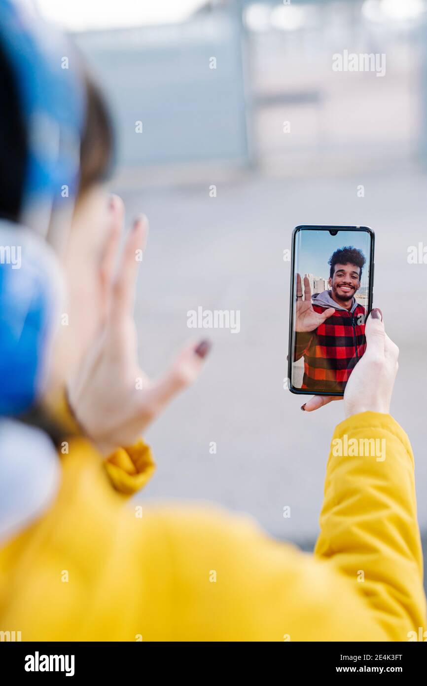 Vertical video young adult waving hi-res stock photography and images ...