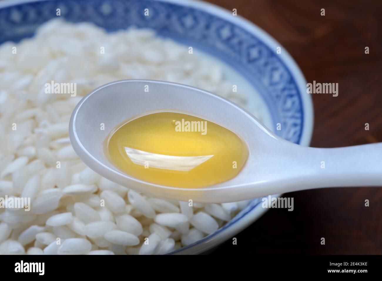 Rice syrup, rice syrup in spoon, rice in bowl, rice honey Stock Photo ...
