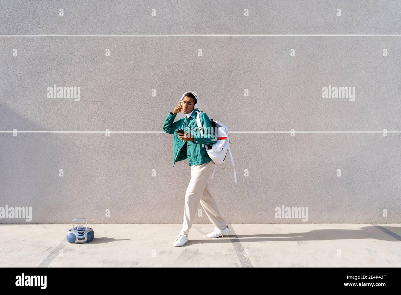 Young man dancing smartphone hi-res stock photography and images - Alamy