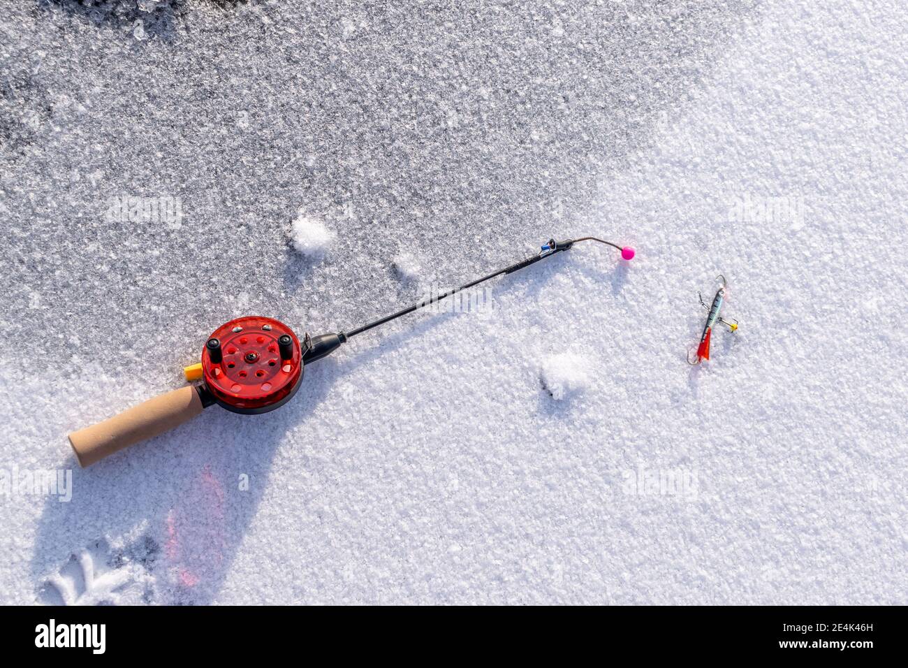 Winter fishing rod on the ice Stock Photo - Alamy