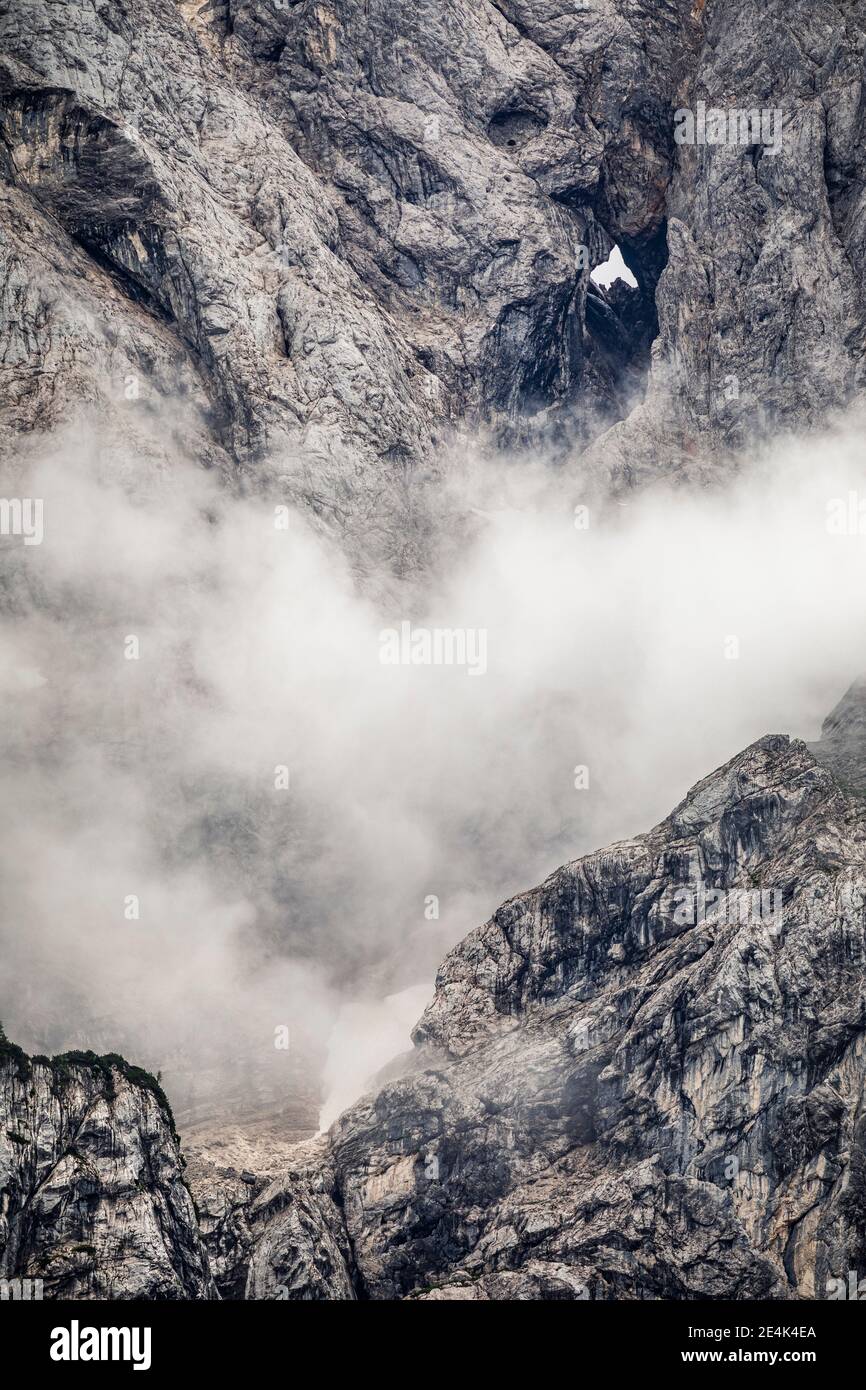Rock formations covered with clouds Stock Photo - Alamy