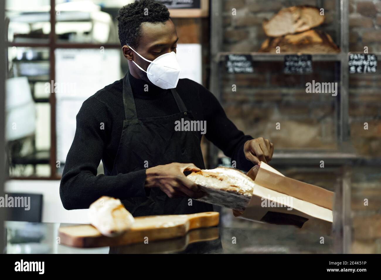 Male bakery owner packing hi-res stock photography and images - Alamy