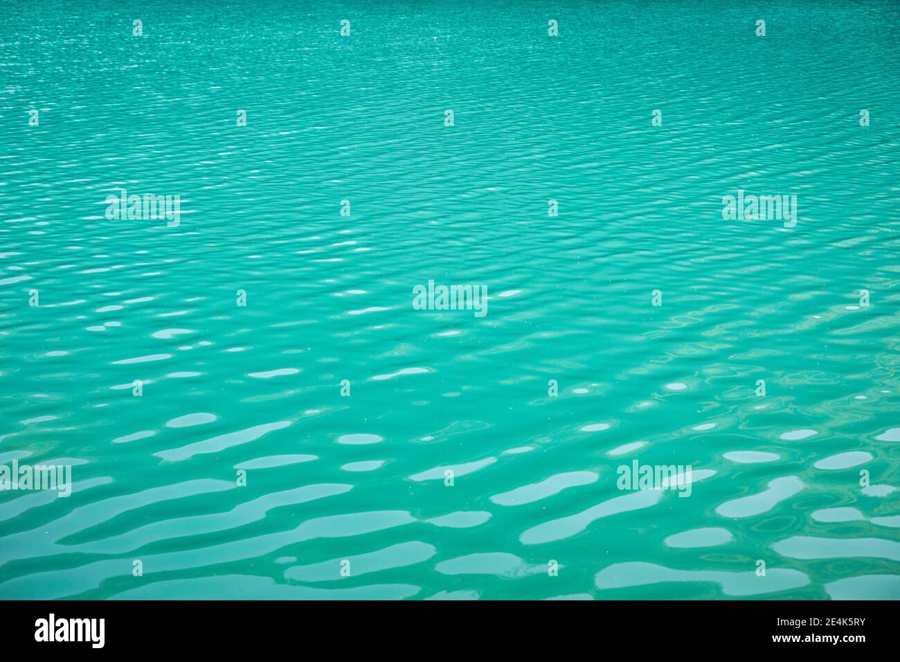 Turquoise lake surface Stock Photo - Alamy