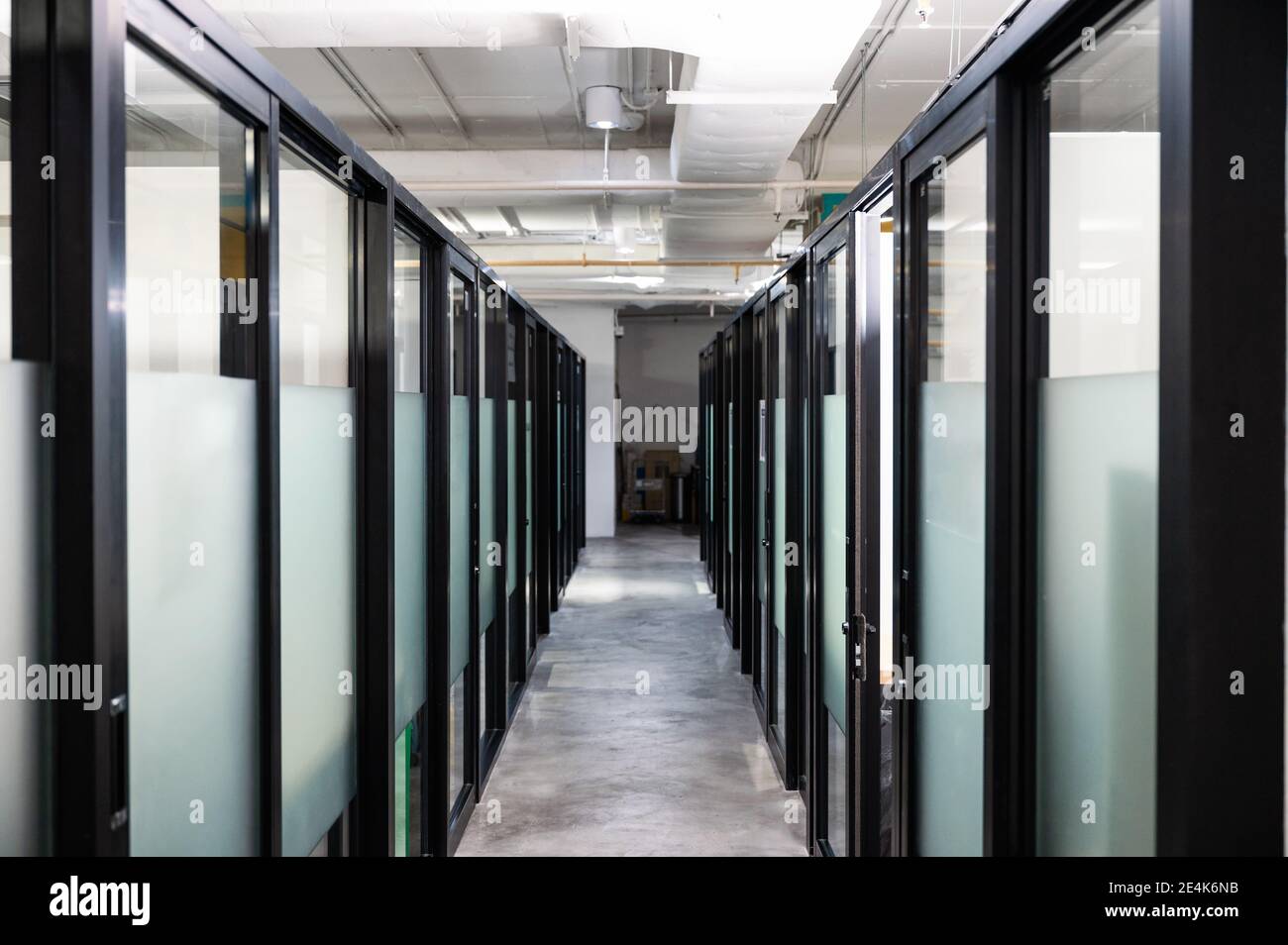 Long corridor with glass door partition in modern office Stock Photo ...