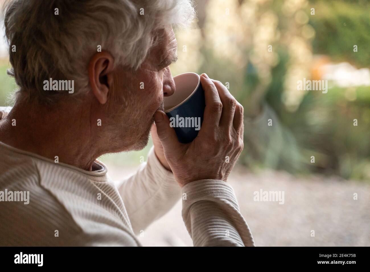 Man standing side view drink hi-res stock photography and images - Alamy