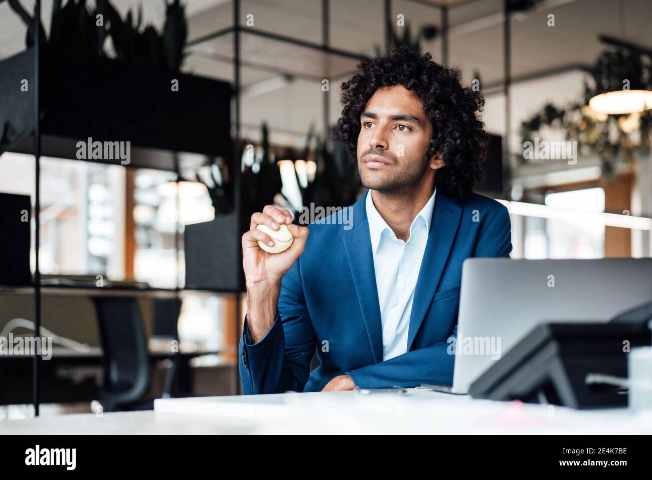 Man squeezing desk hi-res stock photography and images - Alamy