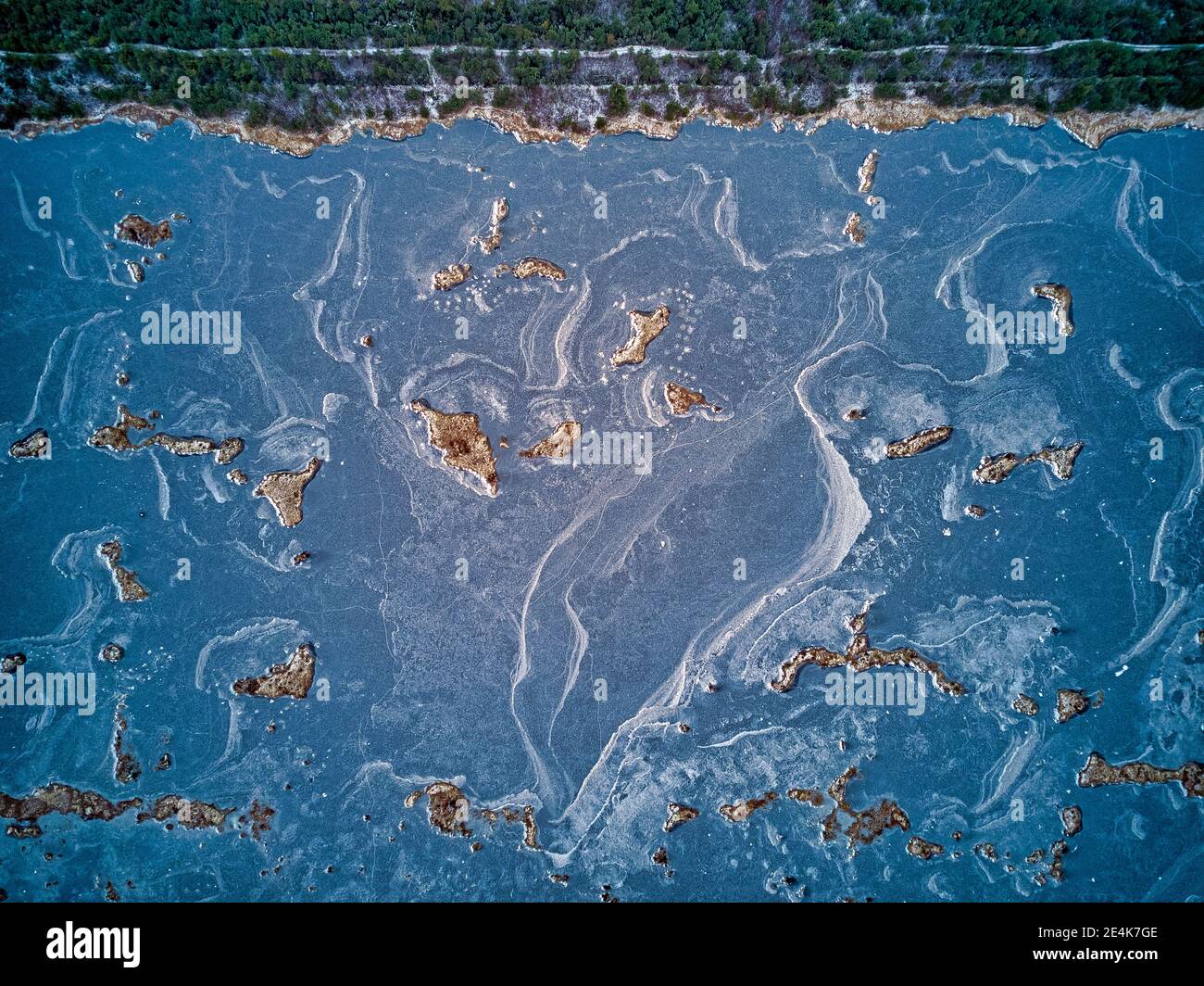 Aerial view of frozen pond Stock Photo - Alamy