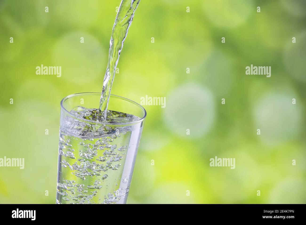 water pouring into glass Stock Photo - Alamy