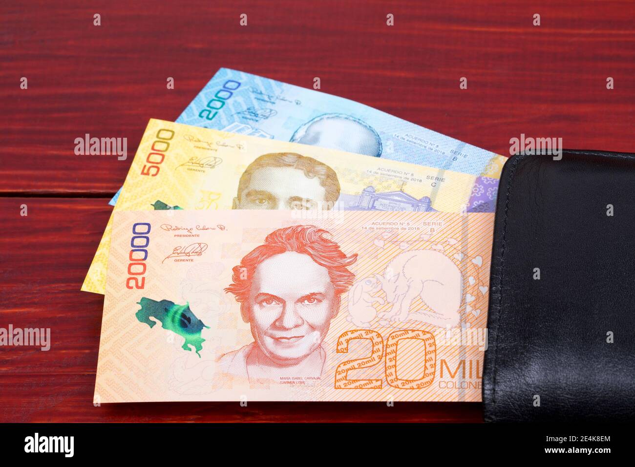 Costa Rican colon in the black wallet Stock Photo - Alamy