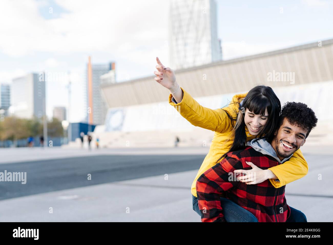 Couple outdoors man piggybacking woman hi-res stock photography and ...