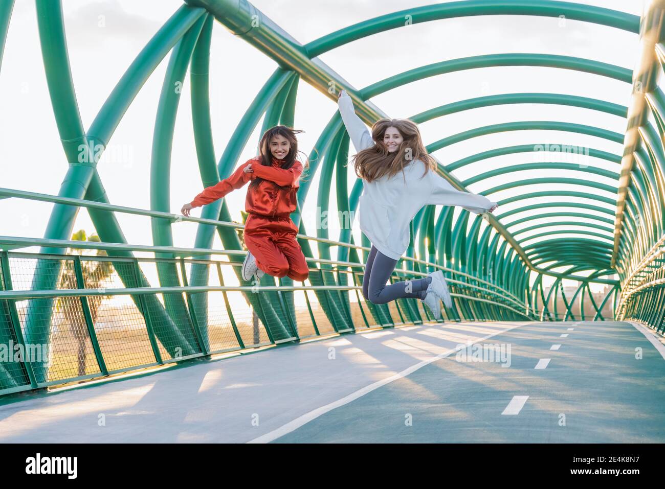 Happy friends sunset jump friendship hi-res stock photography and ...