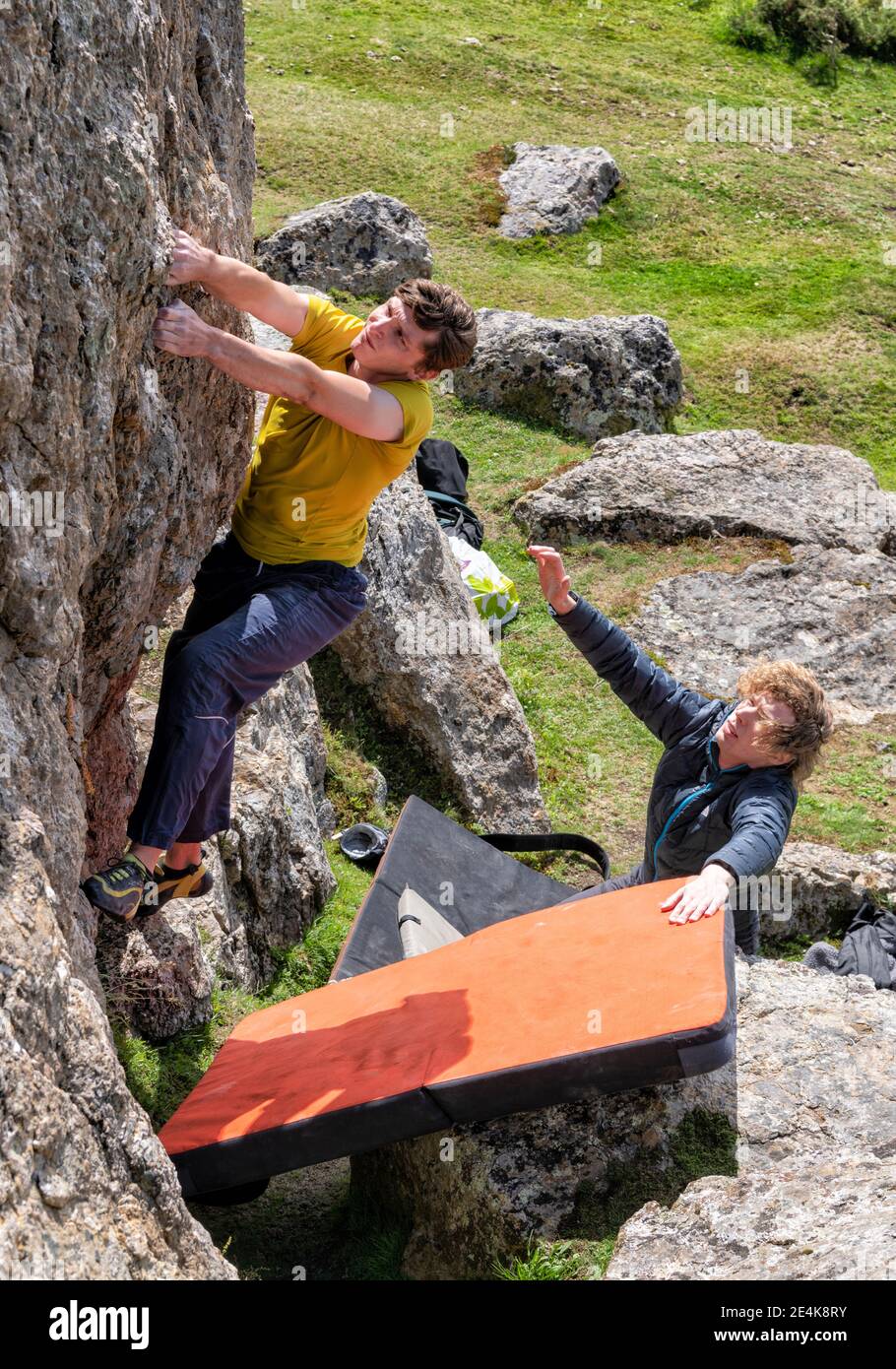 Two young men bouldering at Plumstone Mountain Stock Photo - Alamy