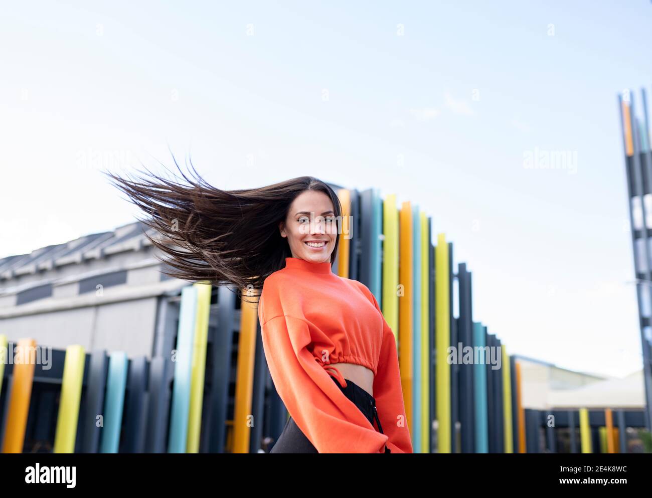 Portrait of beautiful brunette tossing hair Stock Photo - Alamy