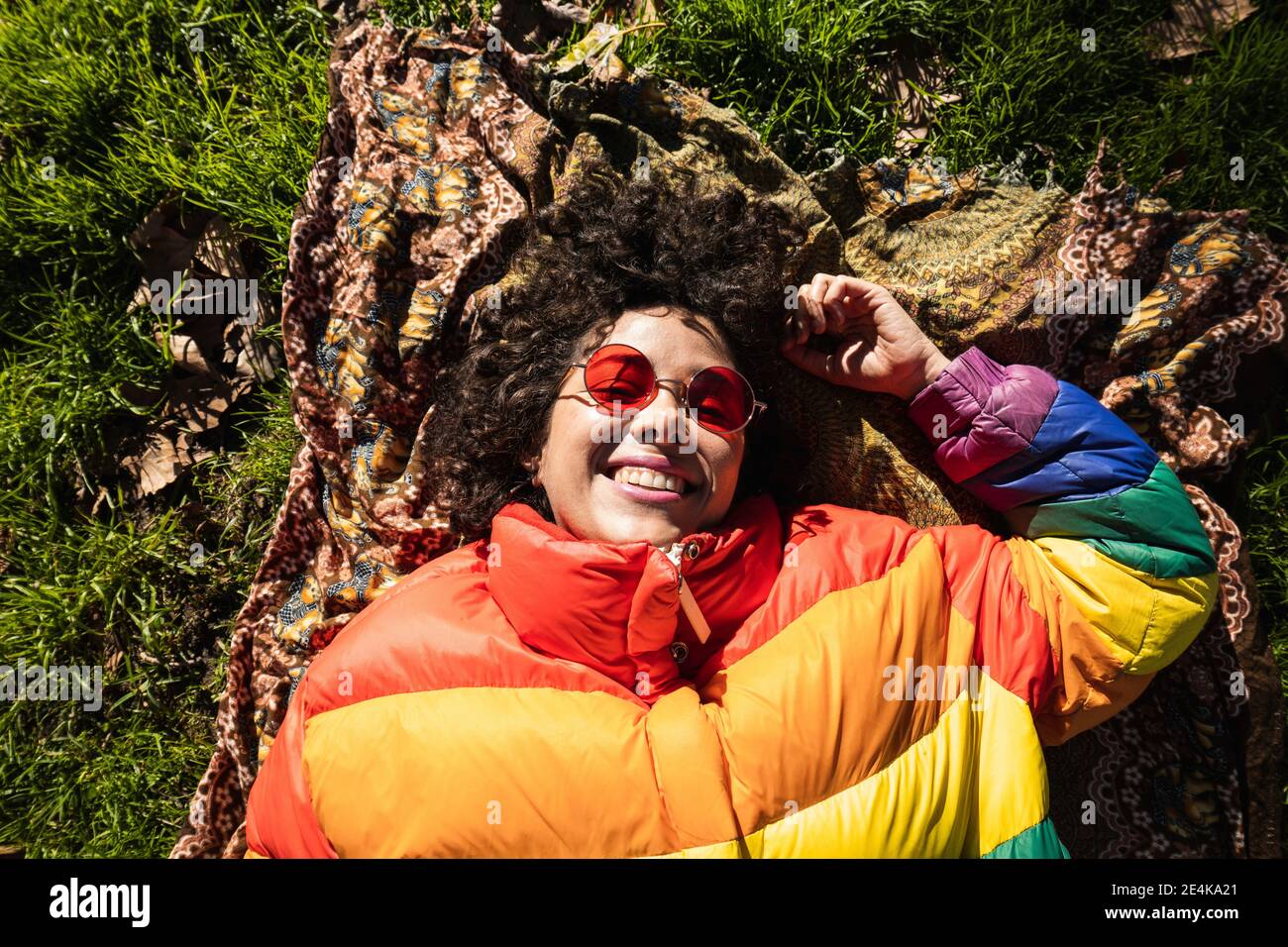 Women lying down with curly hair hi-res stock photography and images ...