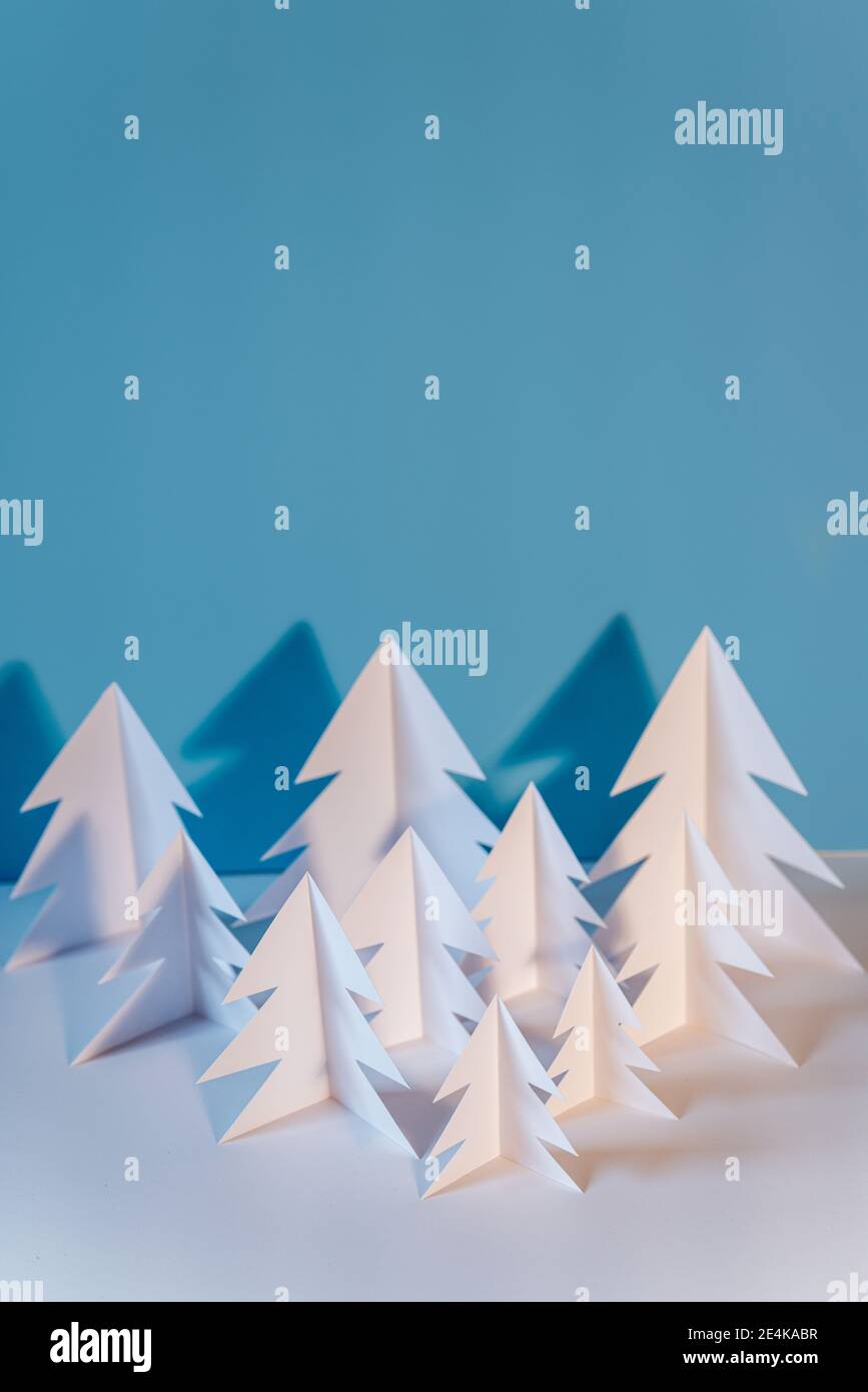 Handmade paper forest with white trees on table in studio Stock Photo ...