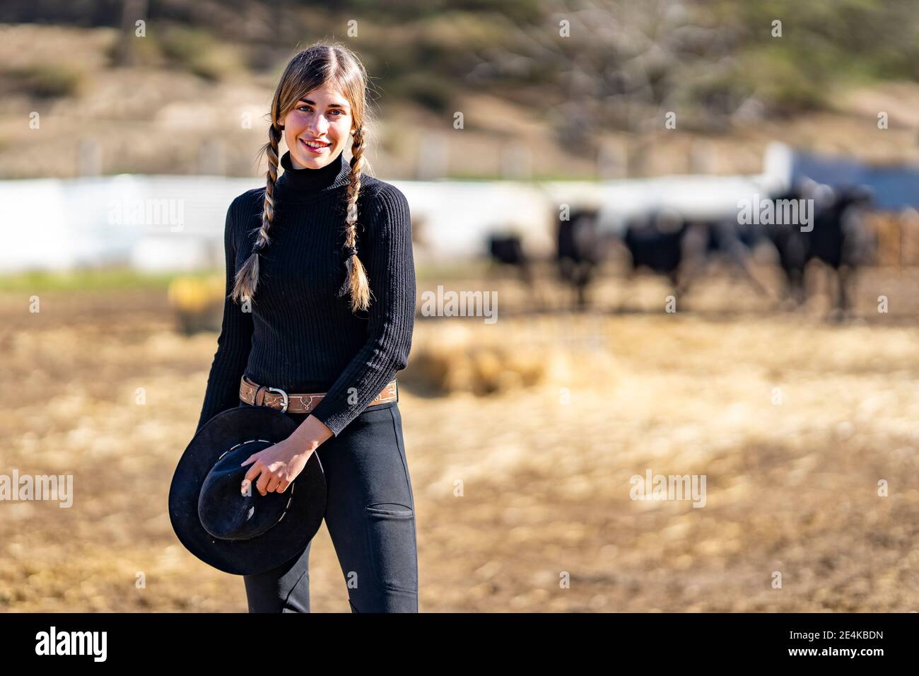 Portrait of female rancher in field Stock Photo - Alamy