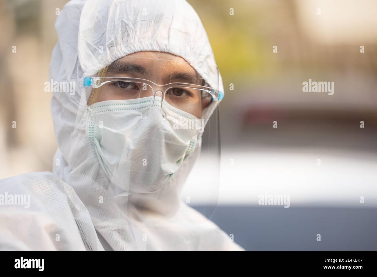 medical scientist in PPE uniform wearing a face mask protective Stock ...