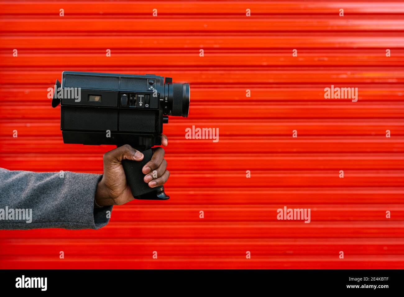 Man holding camera filming hi-res stock photography and images - Alamy