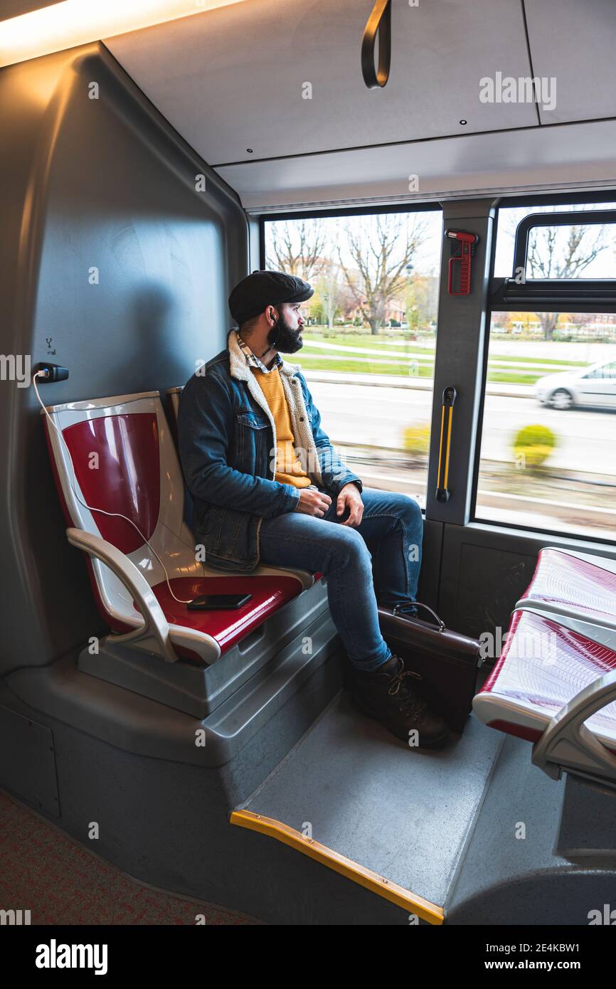 Man looking through bus window day hi-res stock photography and images ...