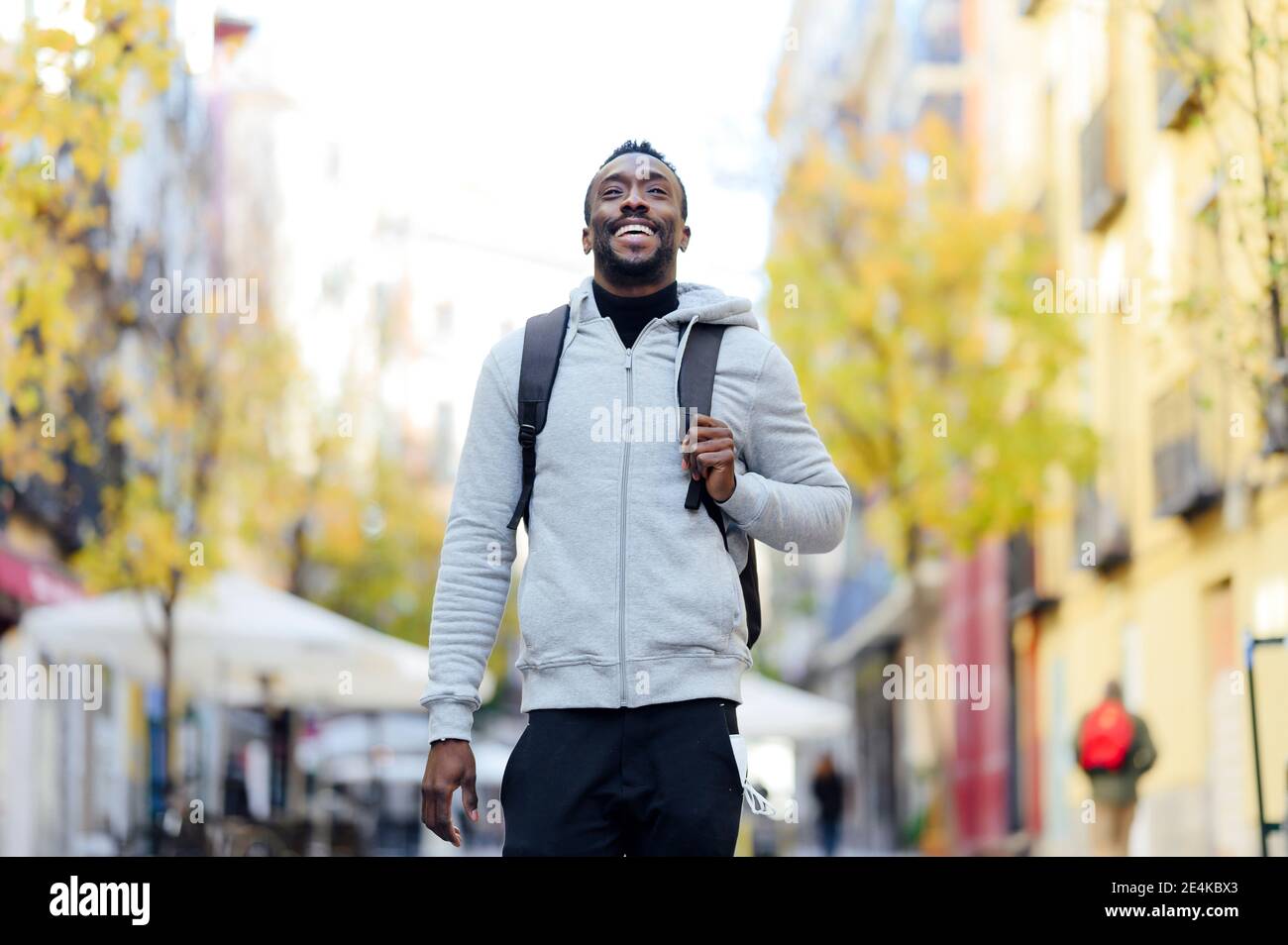 Man carrying backpack walking hi-res stock photography and images - Alamy