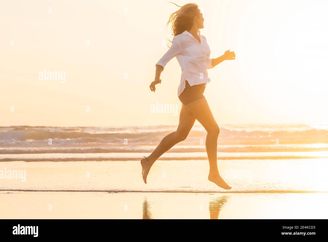 Running into sea, woman hi-res stock photography and images - Alamy
