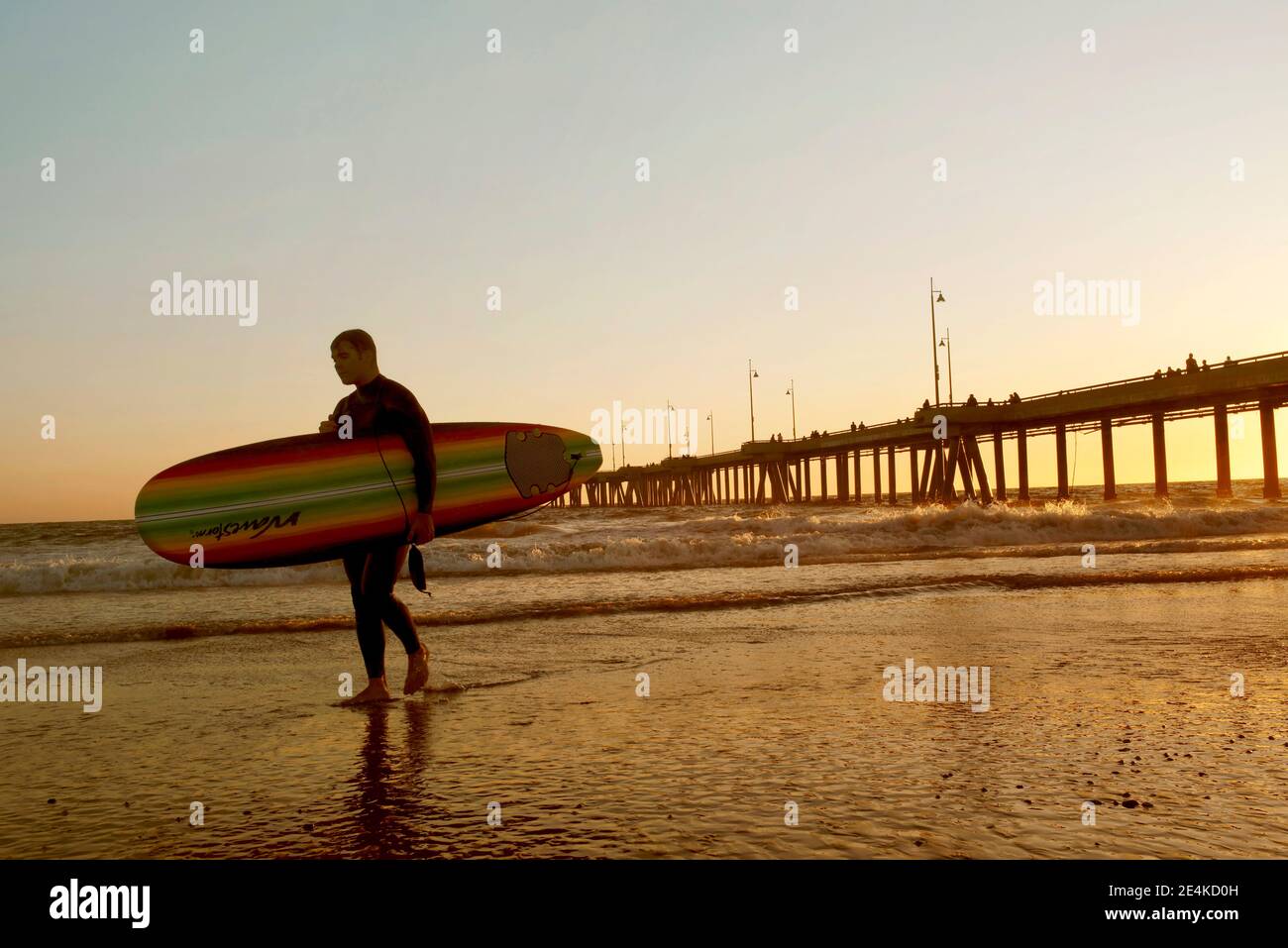 Surfer walking with surfboard hi-res stock photography and images - Alamy