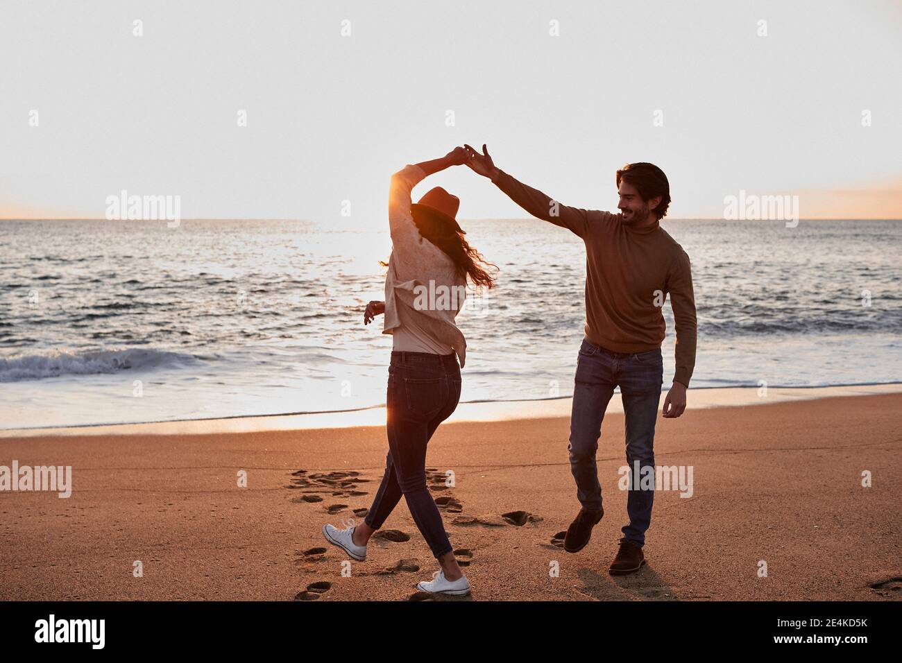 Sunrise over beach dancing sea hi-res stock photography and images - Alamy