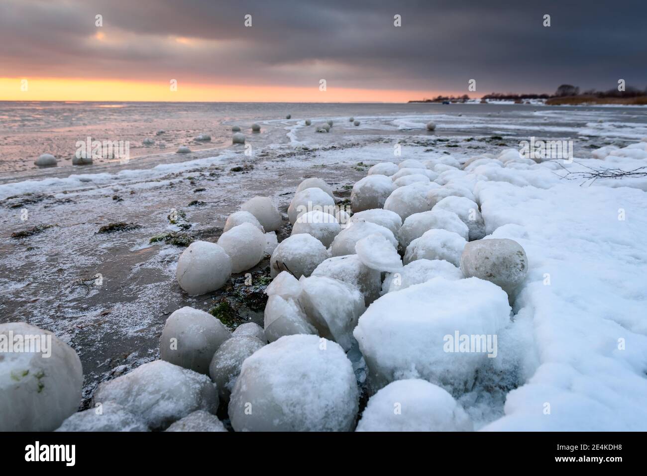 Frozen ice balls on the beach in Jastarnia during winter. Hel Peninsula ...