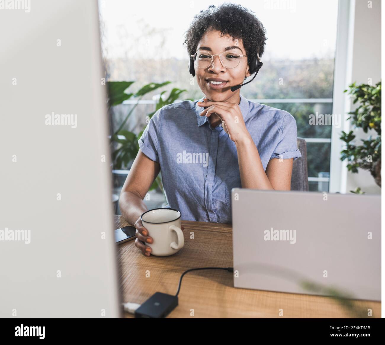 Woman sitting in front of computer hi-res stock photography and images ...