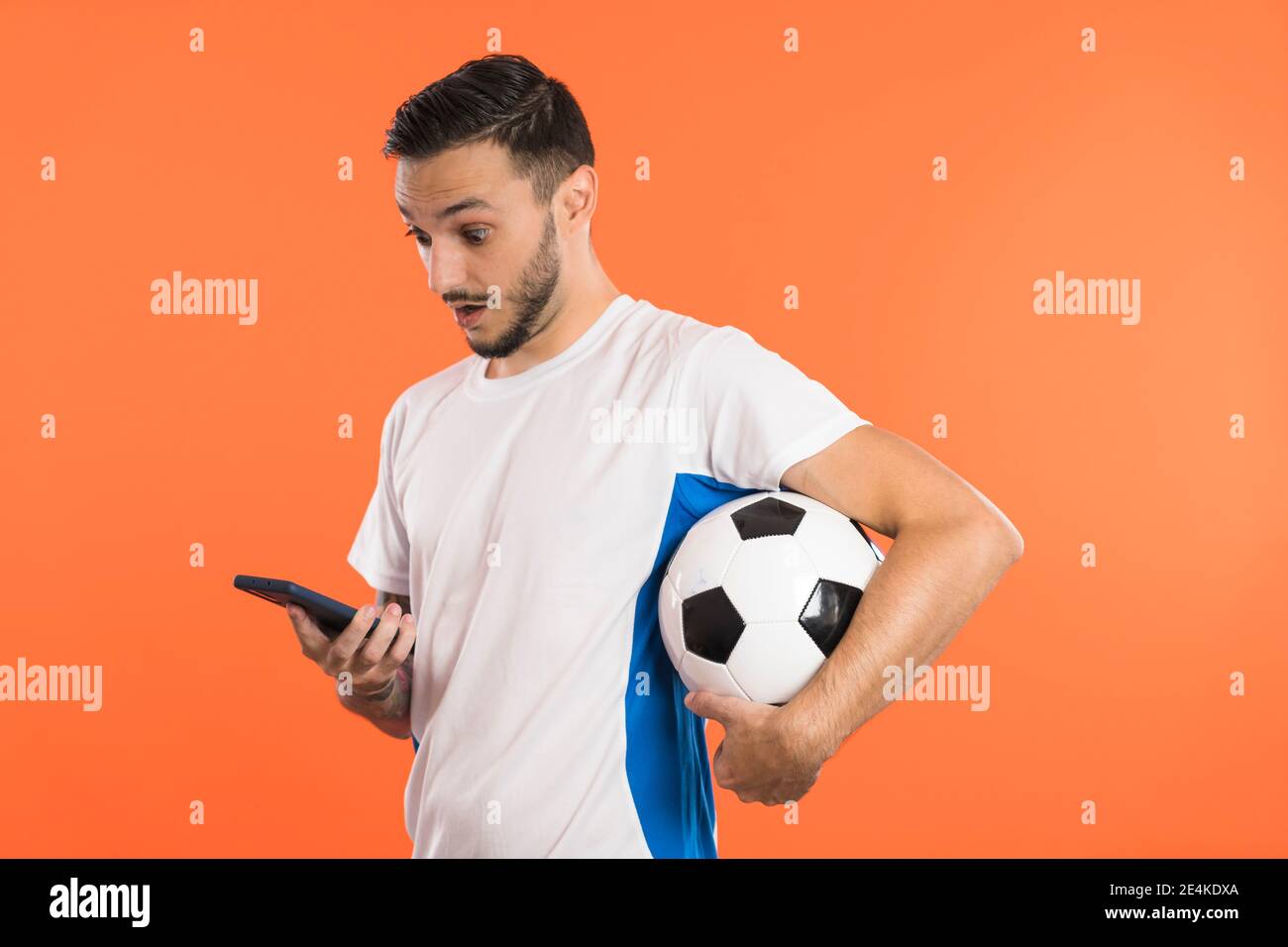 Football player ball under arm hi-res stock photography and images - Alamy