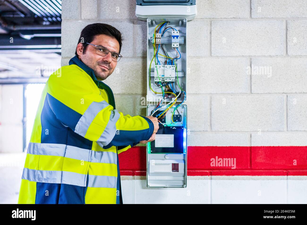 Mechanic Working On Electric Car High Resolution Stock Photography and ...