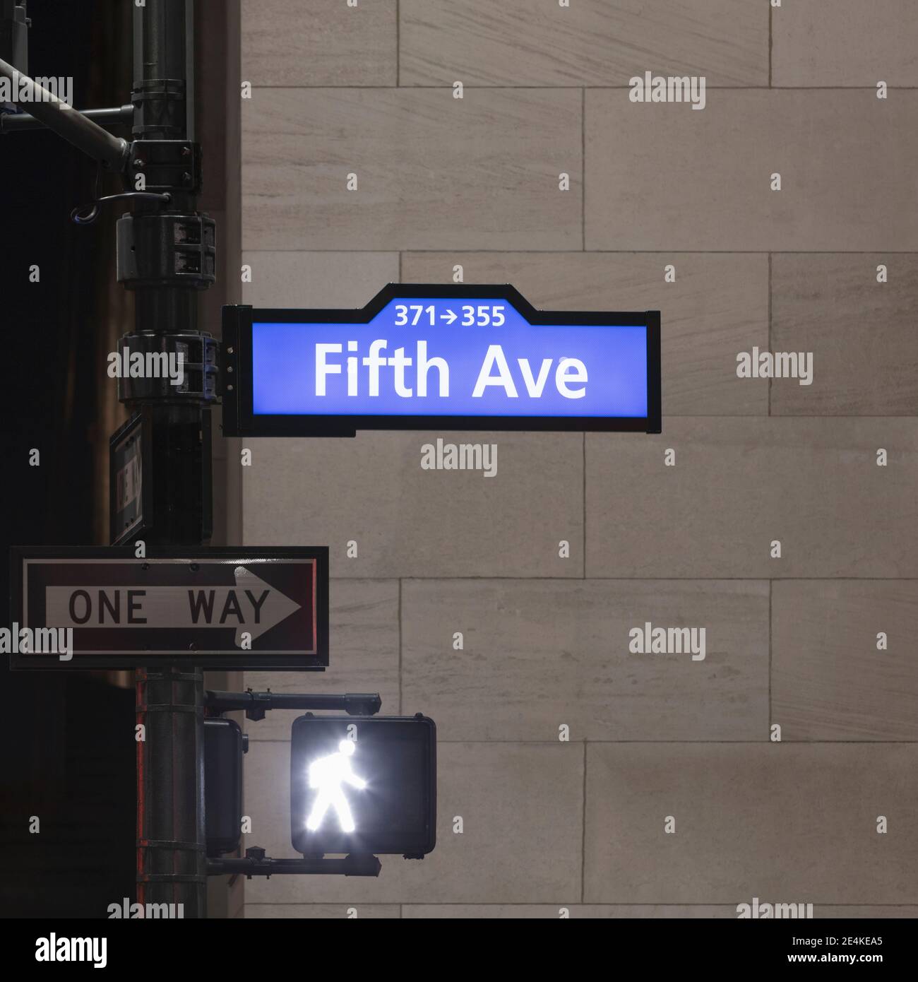 USA, New York, New York City, Fifth Avenue sign and pedestrian lights ...