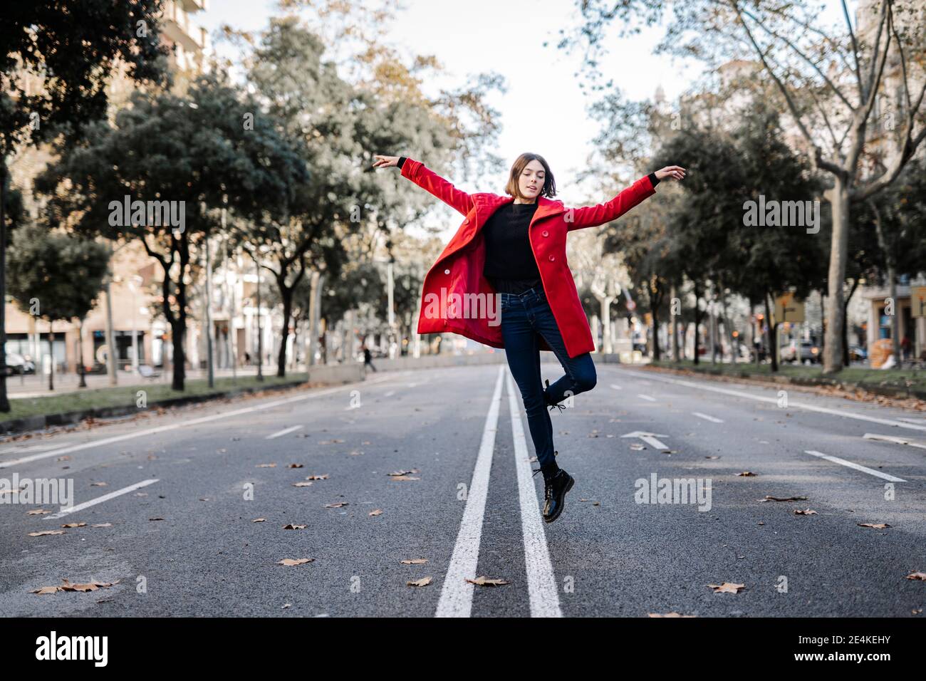 Young woman dancing in street hi-res stock photography and images - Alamy