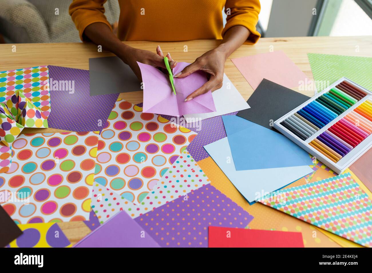Woman folding paper origami hi-res stock photography and images - Alamy