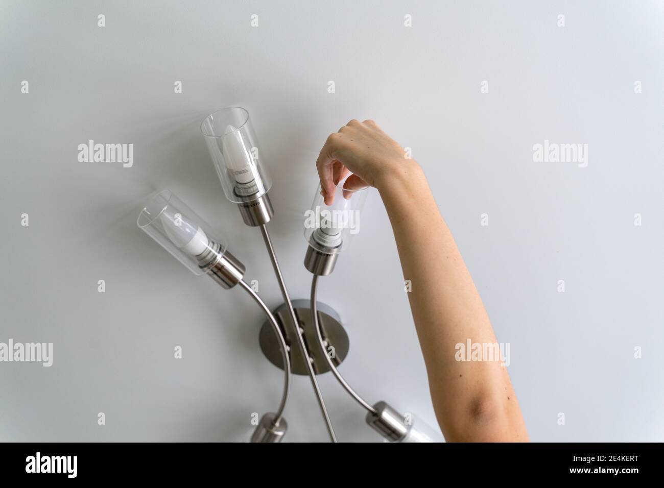 Hand changing light bulb close hi-res stock photography and images - Alamy