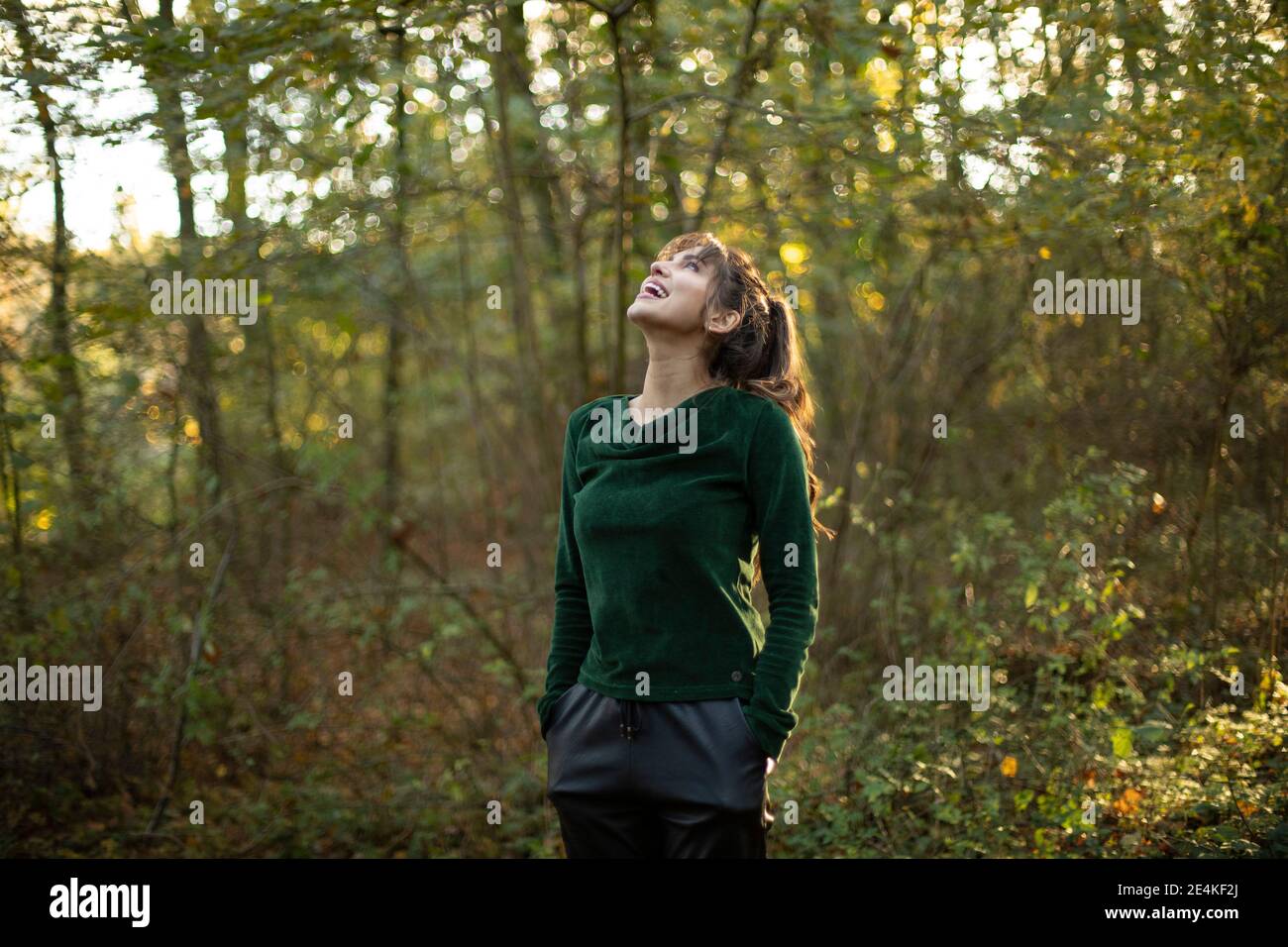 Happy woman standing hands up hi-res stock photography and images - Alamy