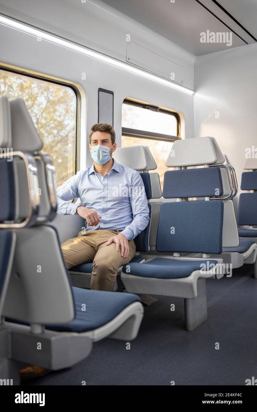 Man wearing face mask train travel hi-res stock photography and images ...