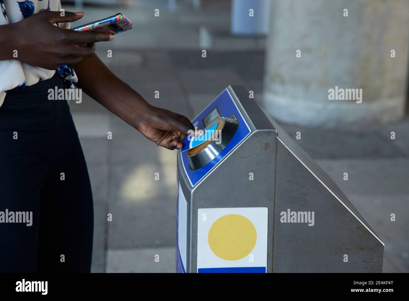 Holding ticket for scanning hi-res stock photography and images - Alamy