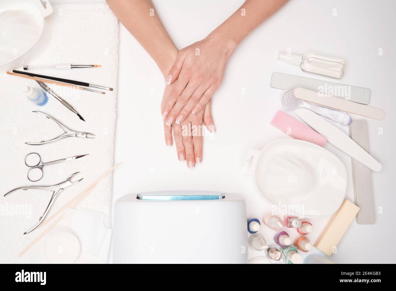 top view of manicure tools and Woman Preparing her hands for getting ...