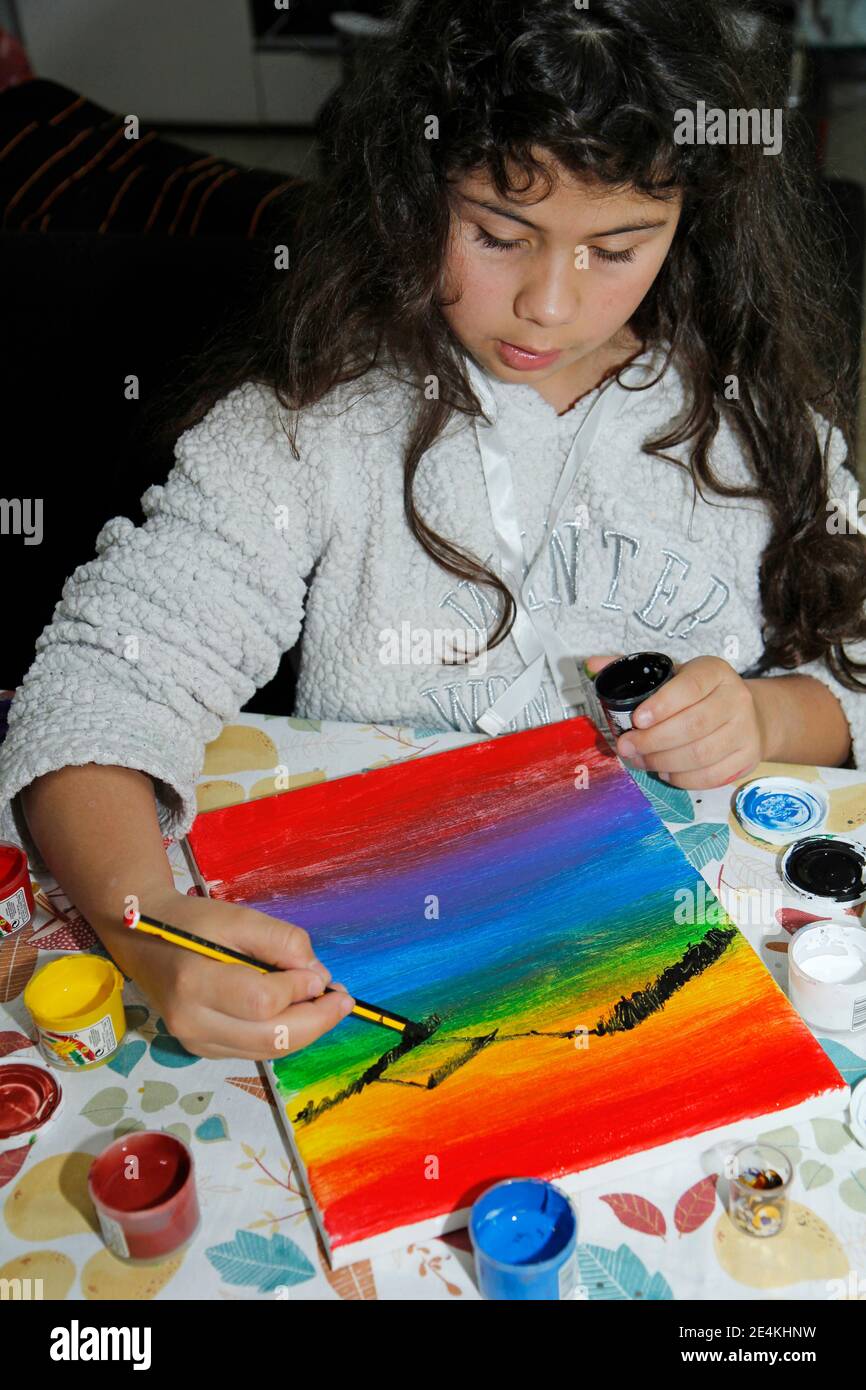 Girl painting a picture Stock Photo - Alamy