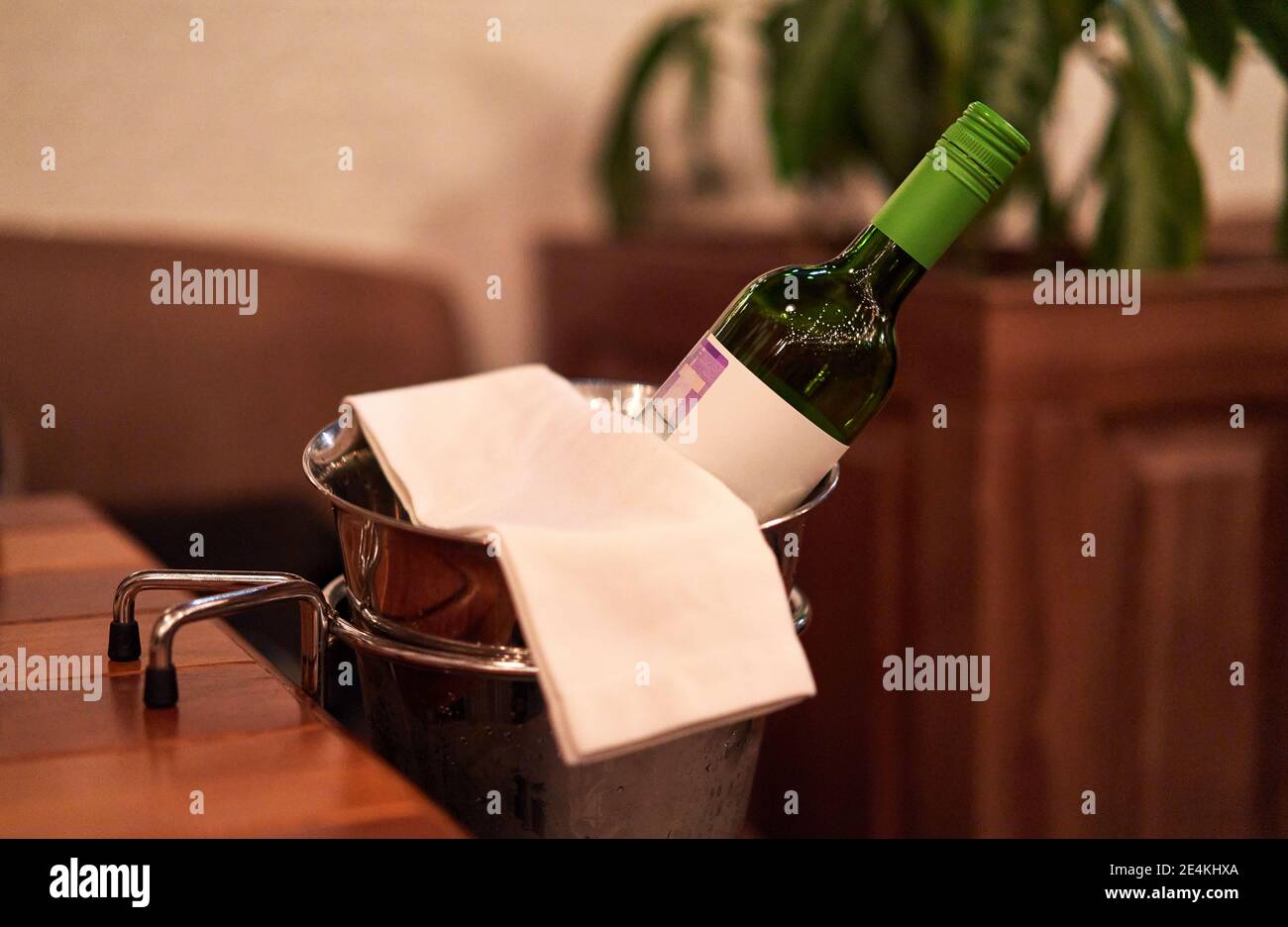 bottle of wine in an ice bucket Stock Photo - Alamy
