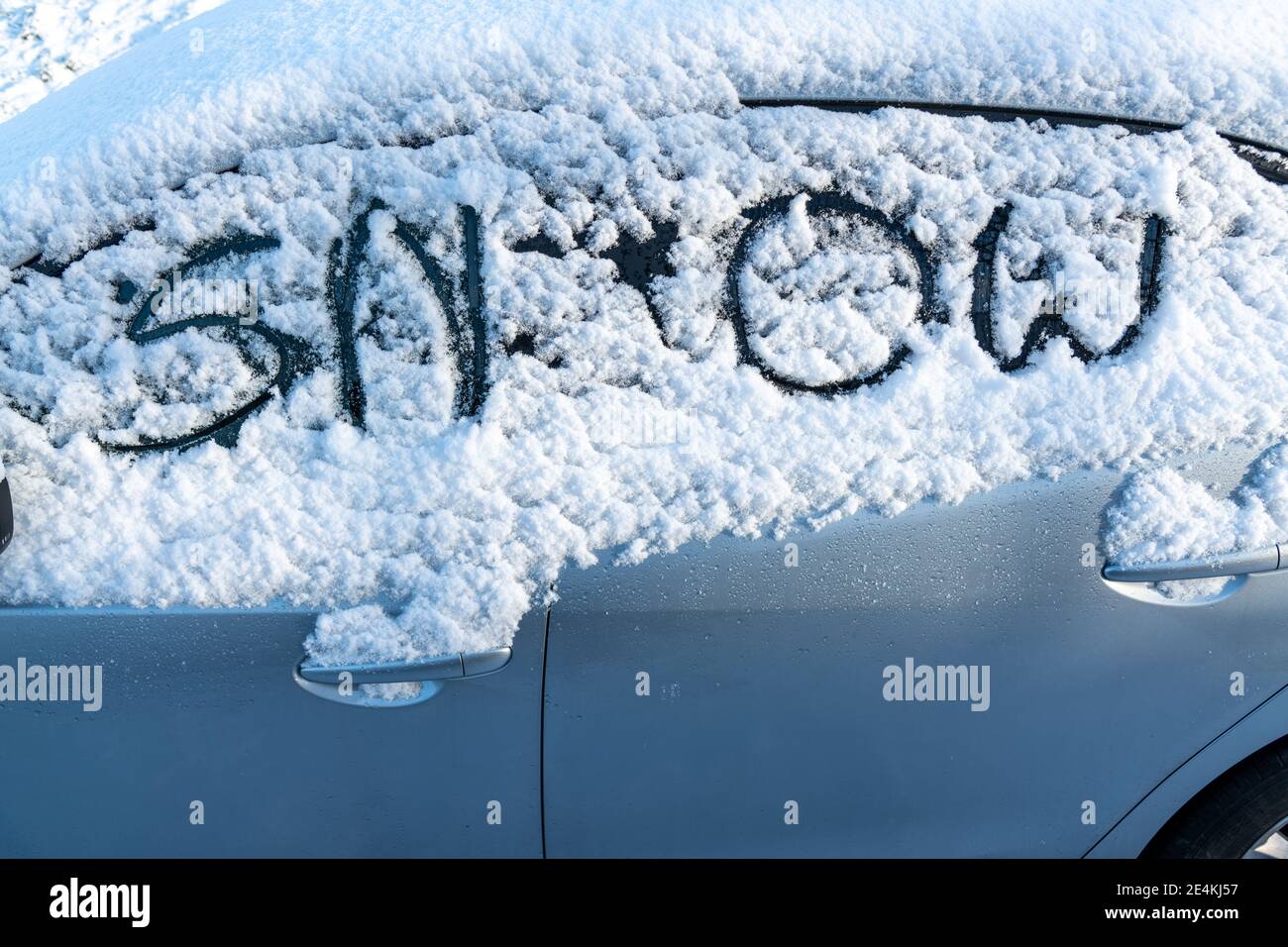 A car under the snow. Snow and ice on cars after extreme snowfall in ...