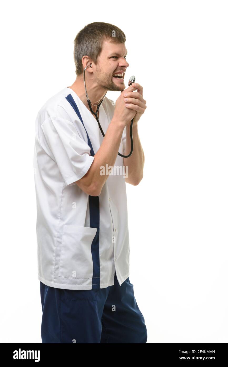 Irritated doctor yelling into stethoscope head isolated on white ...