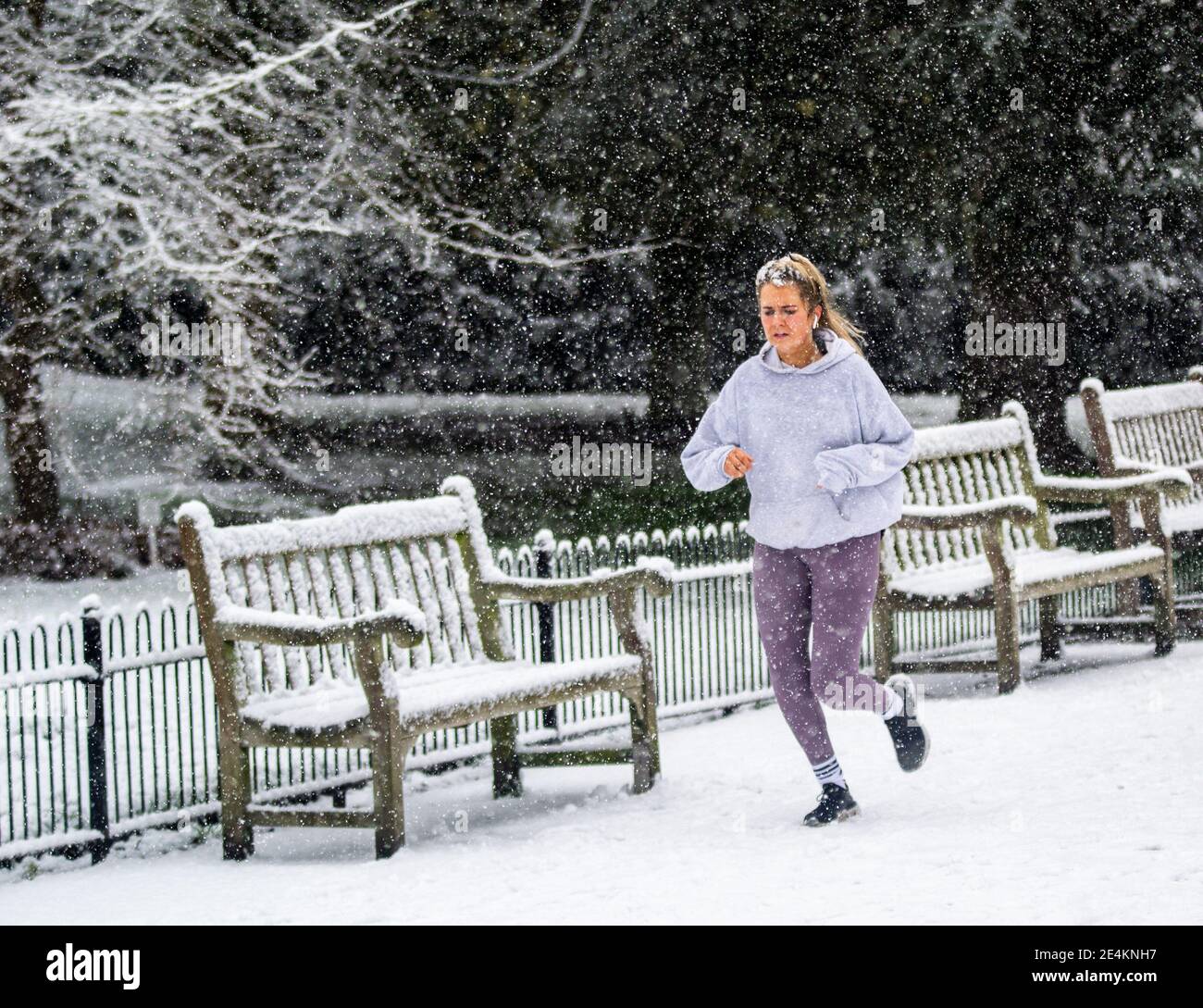 Leamington Spa, Warwickshire, UK: 24th January 2021: Joggers bear the ...